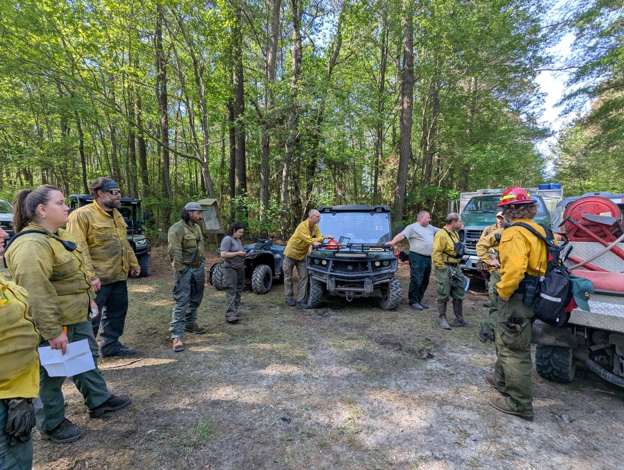 A burn crew listens to a safety briefing and goes over the prescribed ...
