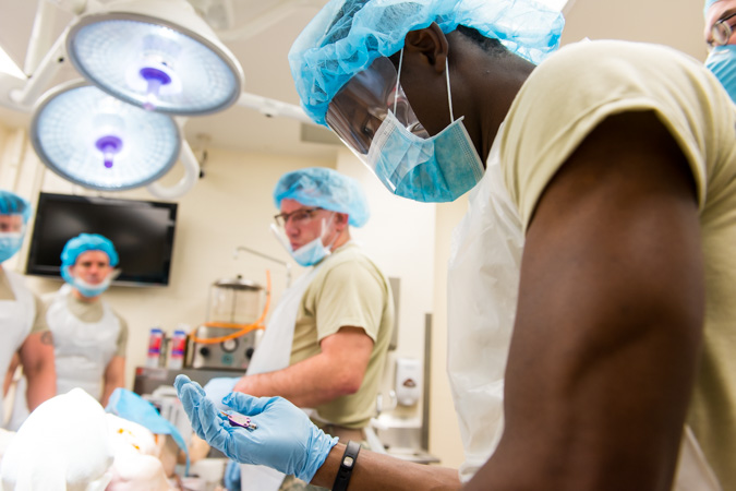 Medics practice immediate care procedures on cadavers, learning to save ...